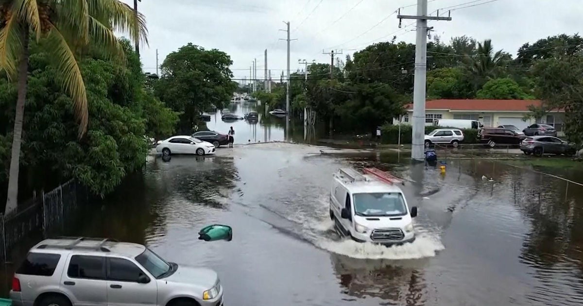 Two people die after historic rainfall in Florida - CBS News