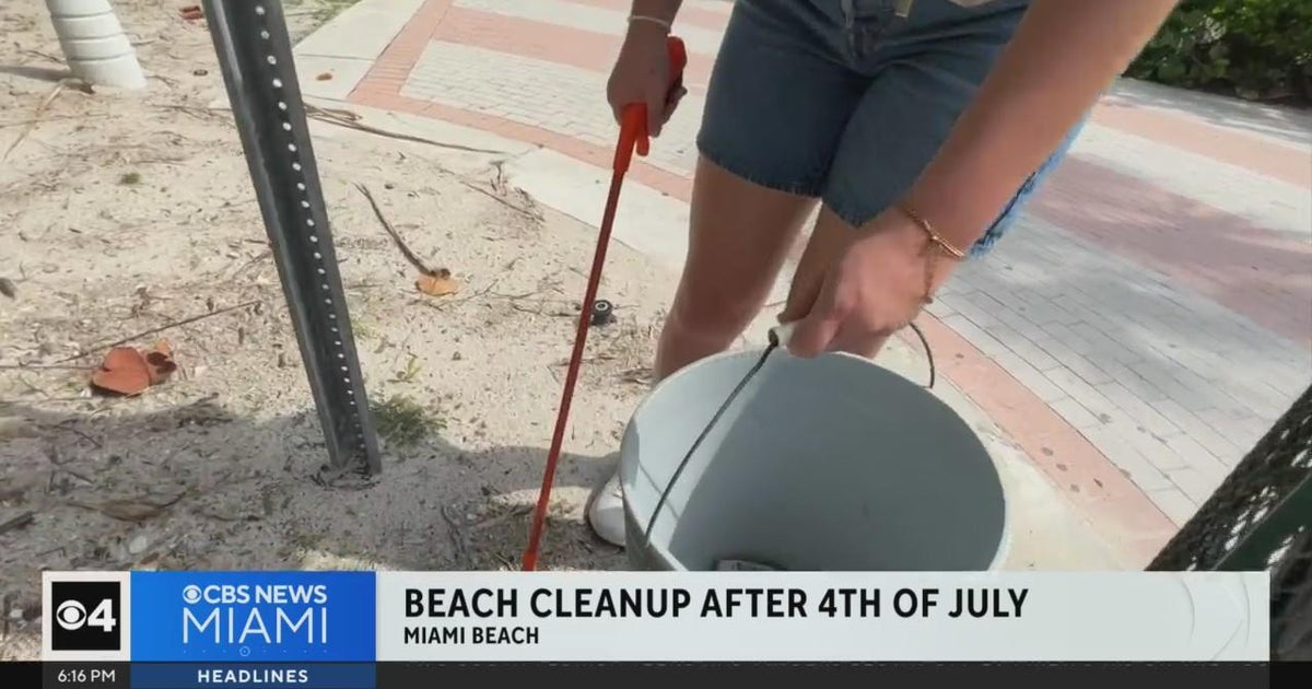 Volunteers clean up trash and debris at Miami Beach on "dirtiest beach ...