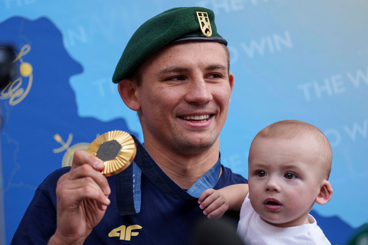 Ukrainian gold medal-winning boxer returns home to lift spirits amid ...