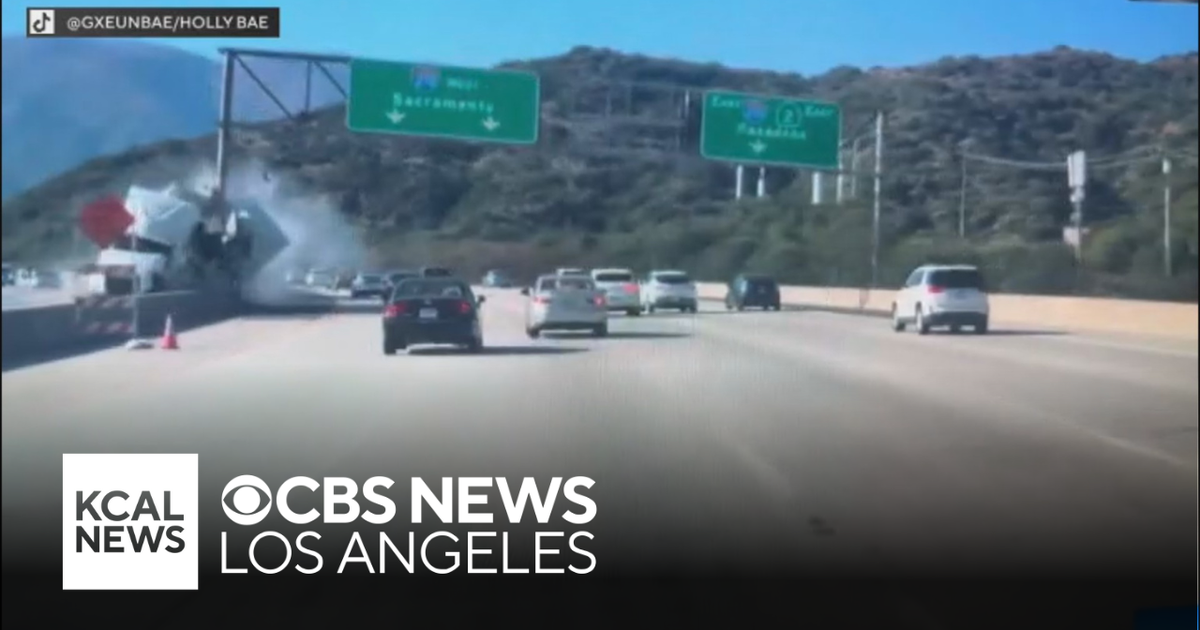 Dashcam catches the moments a big rig carrying raisins slams into a ...