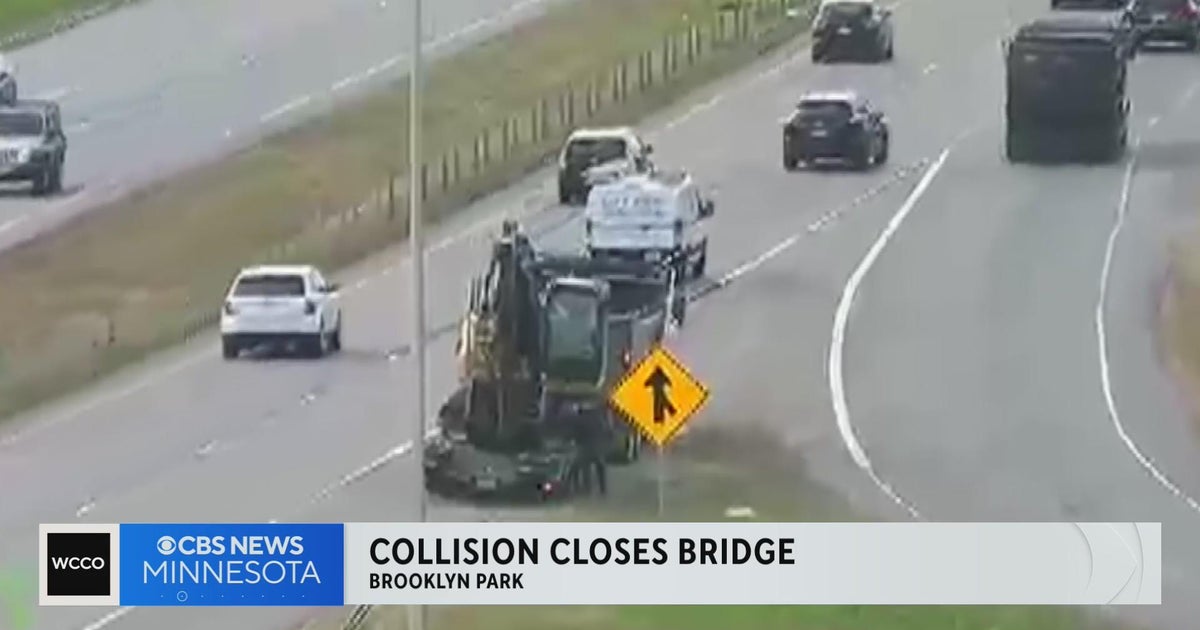 Truck carrying backhoe hits bridge over Highway 169 - CBS Minnesota