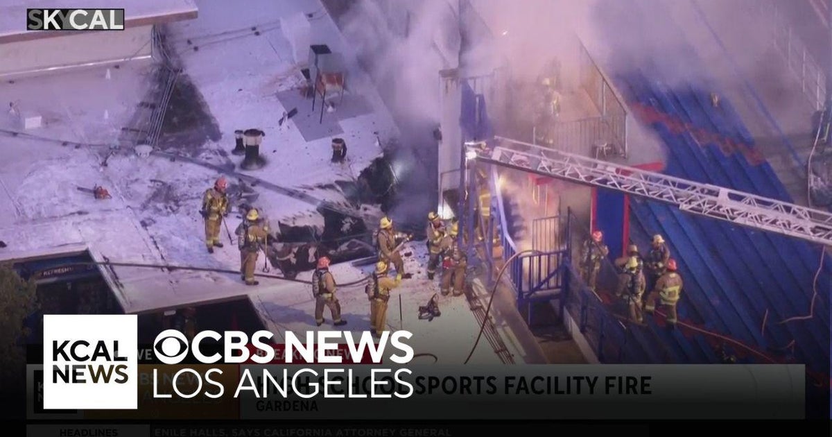 Fire crews work to put out a bleacher fire at a Gardena high school ...
