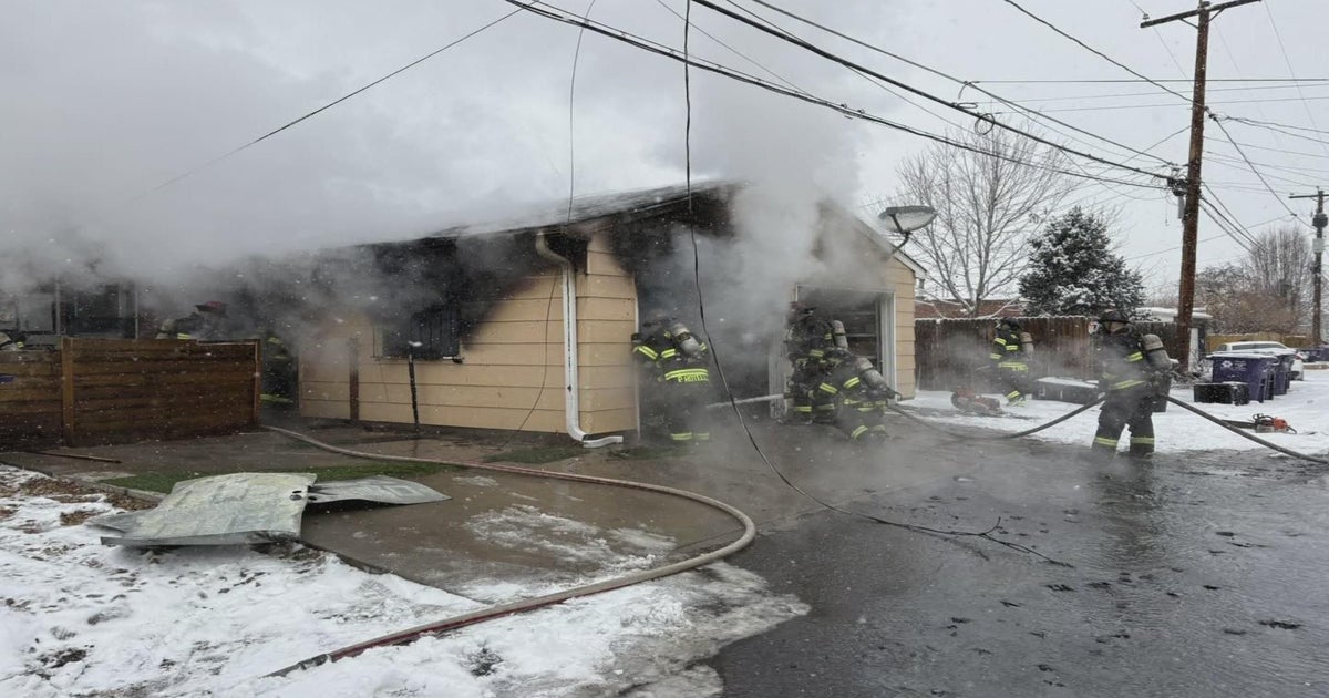 Denver firefighters keep garage fire from spreading to home - CBS Colorado