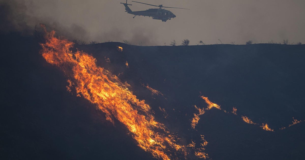 Crews around Los Angeles battling new wildfires, Trump threatening to withhold aid - CBS News