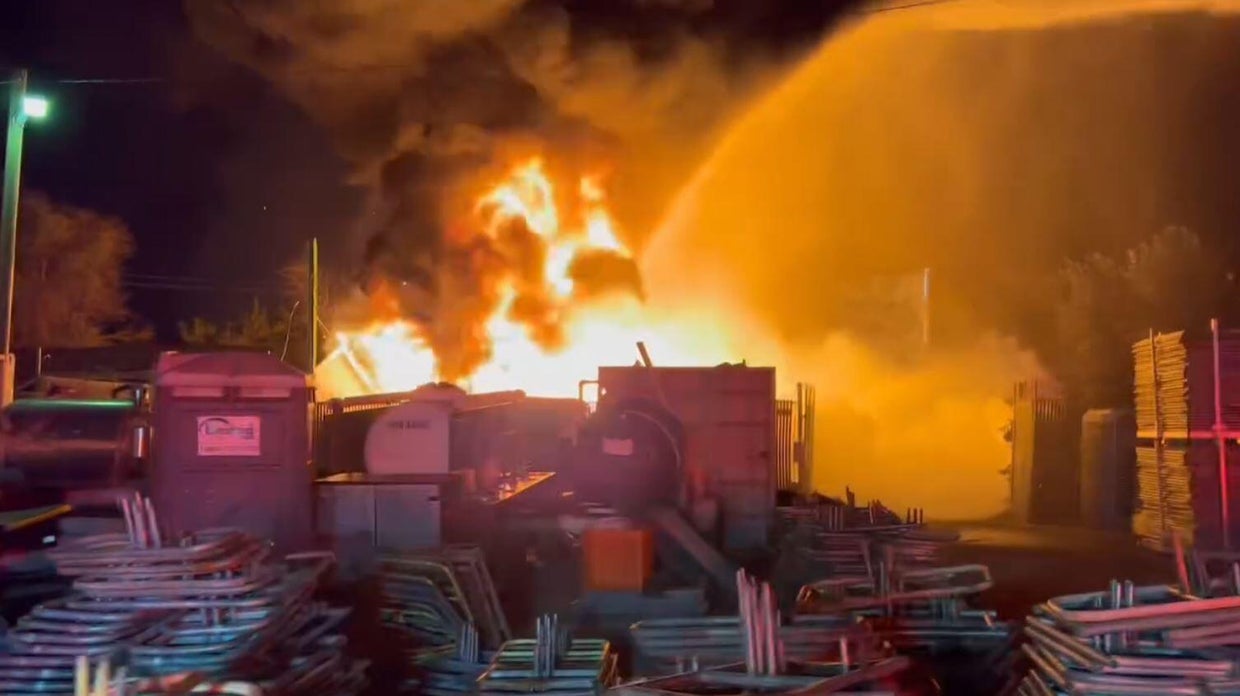 Crews stop large Modesto commercial yard fire from spreading to ...