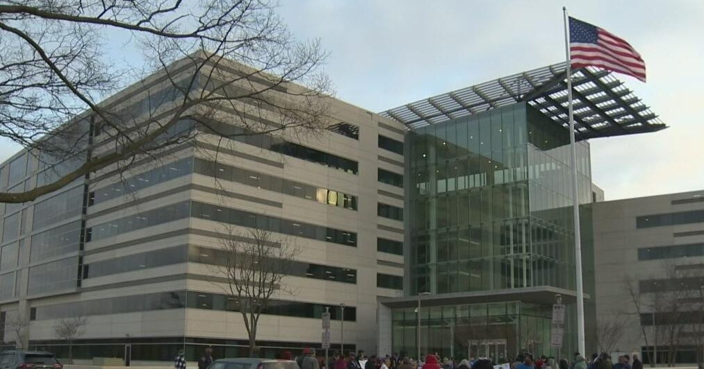 Federal workers rally outside Baltimore courthouse during hearing on ...