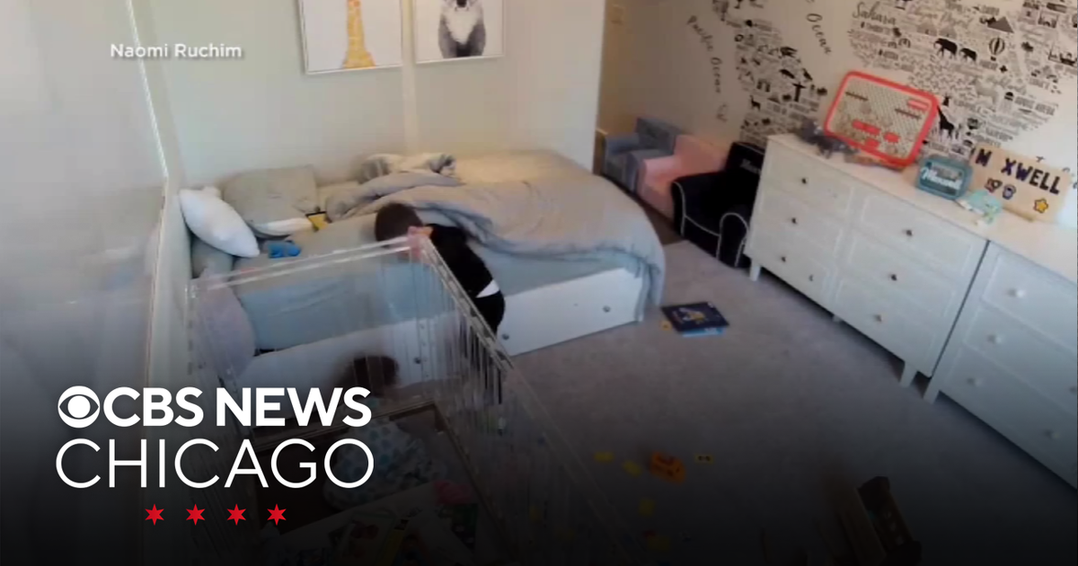 Brother's scheme to help sister escape crib caught on camera - CBS Chicago