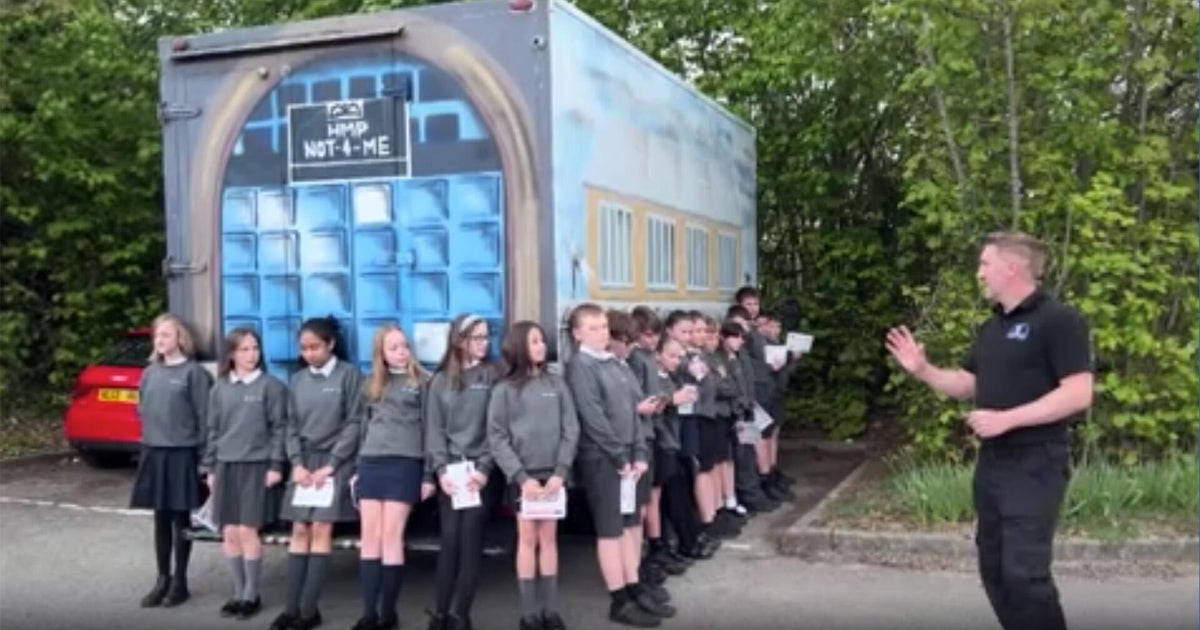 Mobile prison cells show students what life behind bars is like - CBS News