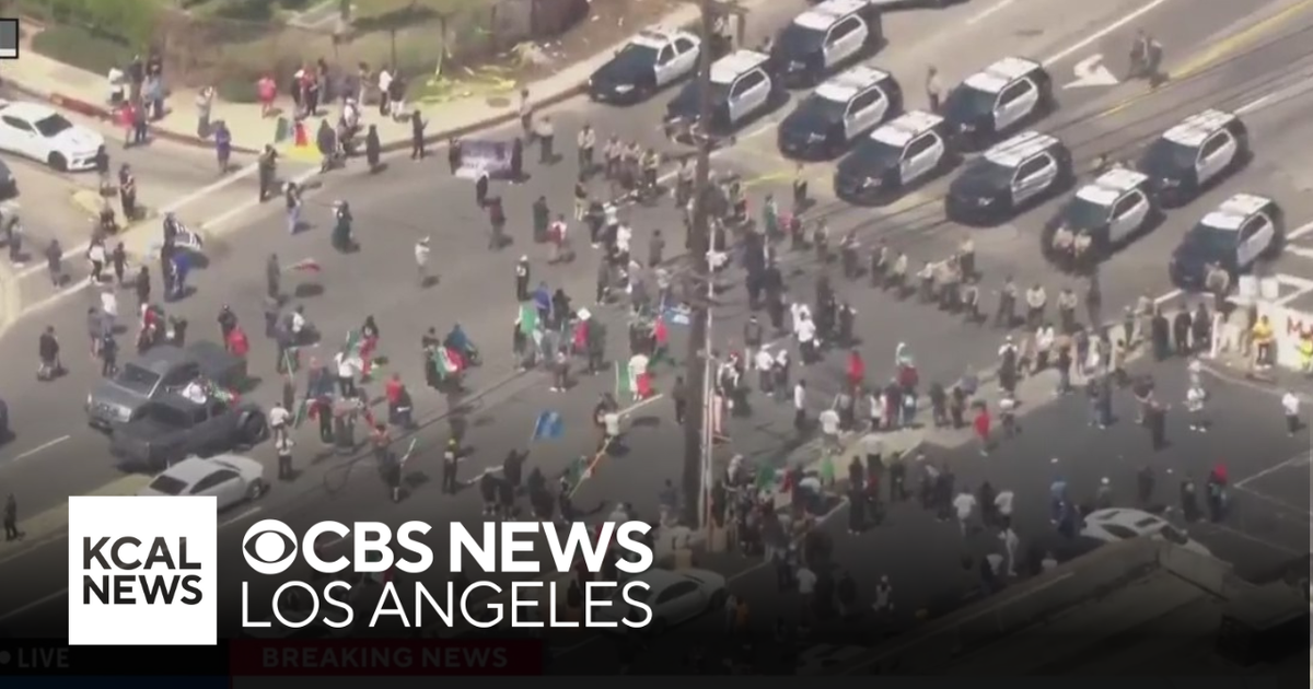 Protesters gather in Paramount after immigrations enforcement officers ...