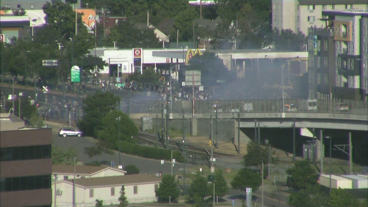 Protesters clash with Denver police, cause road closure - CBS Colorado