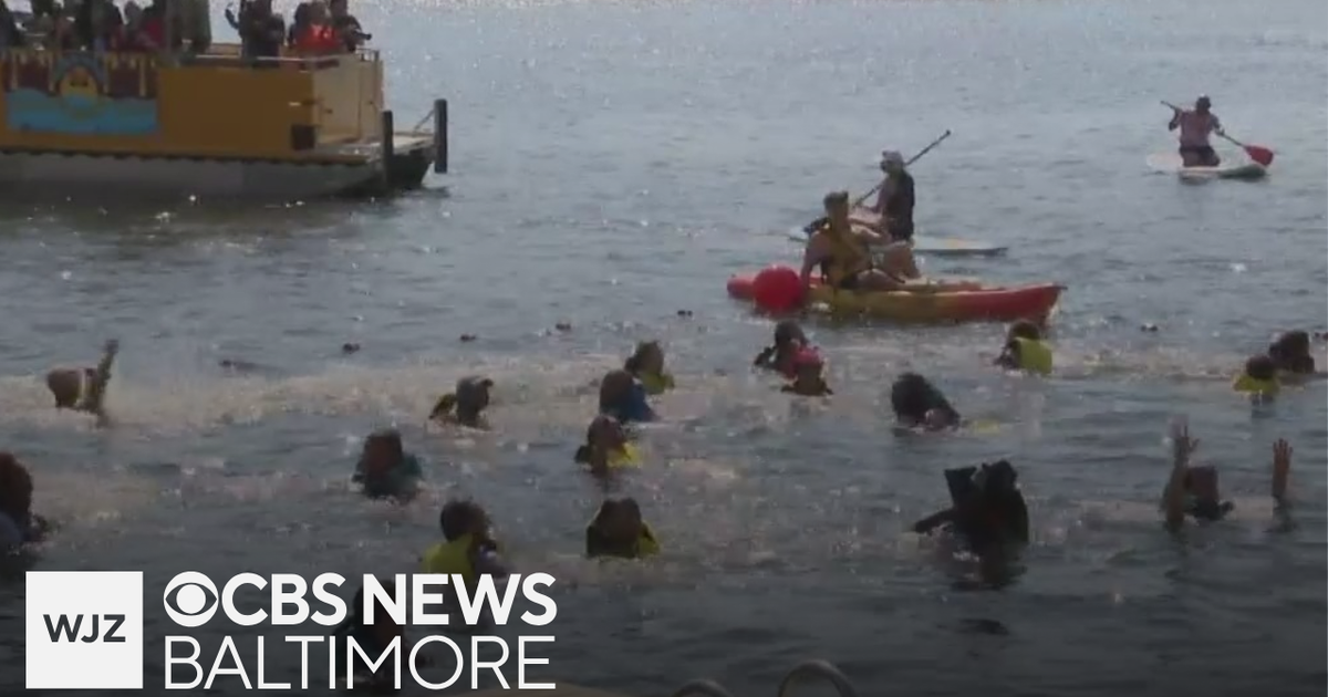 Nearly 200 people signed up to swim in Baltimore's Inner Harbor during ...