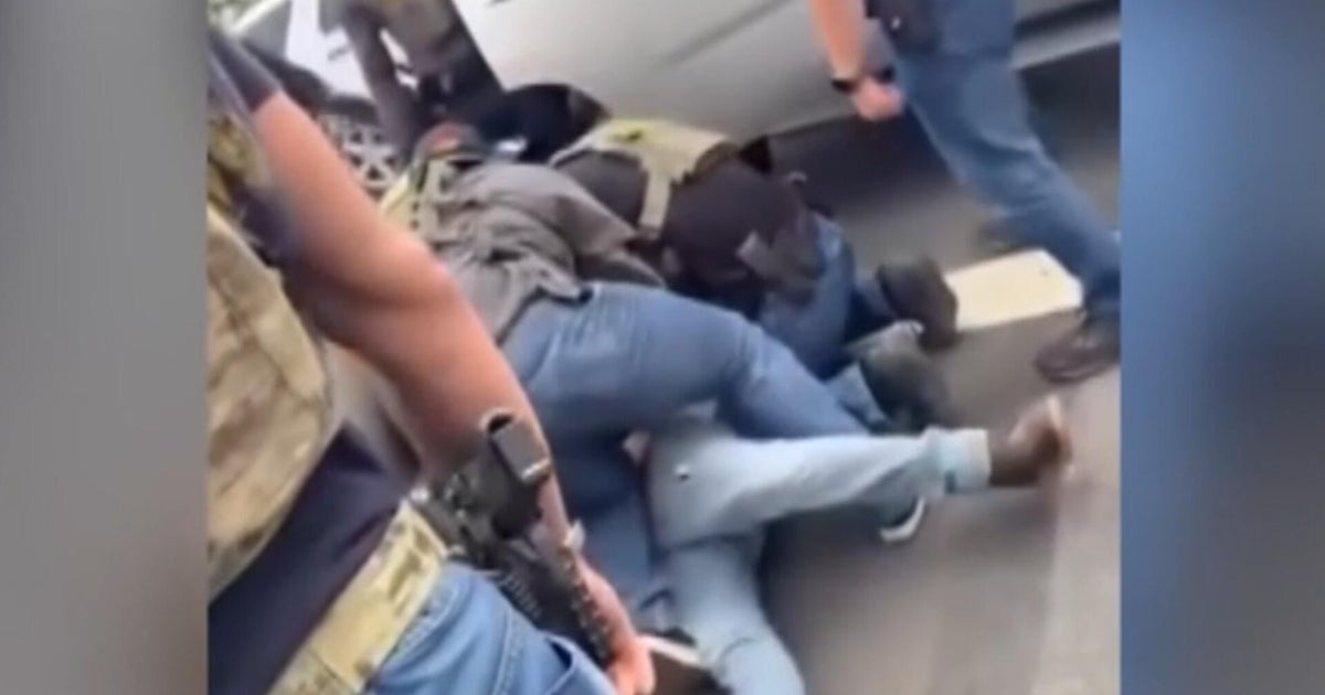 Father of 3 Marines violently detained by ICE, son speaks out - CBS News