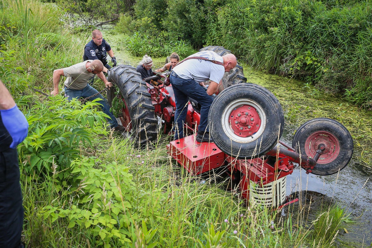Man rushed to hospital after being trapped under tractor in water ...