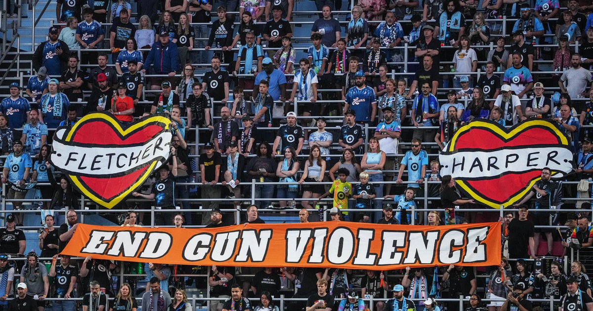 Banner held at MNUFC game reading "End Gun Violence" carries lineage to ...