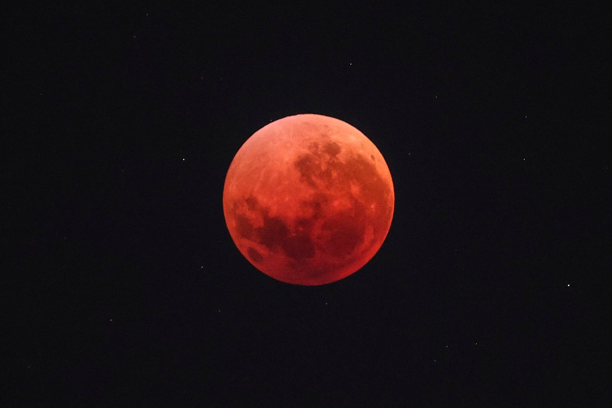 Blood moon rises during total lunar eclipse. See the photos. - CBS News