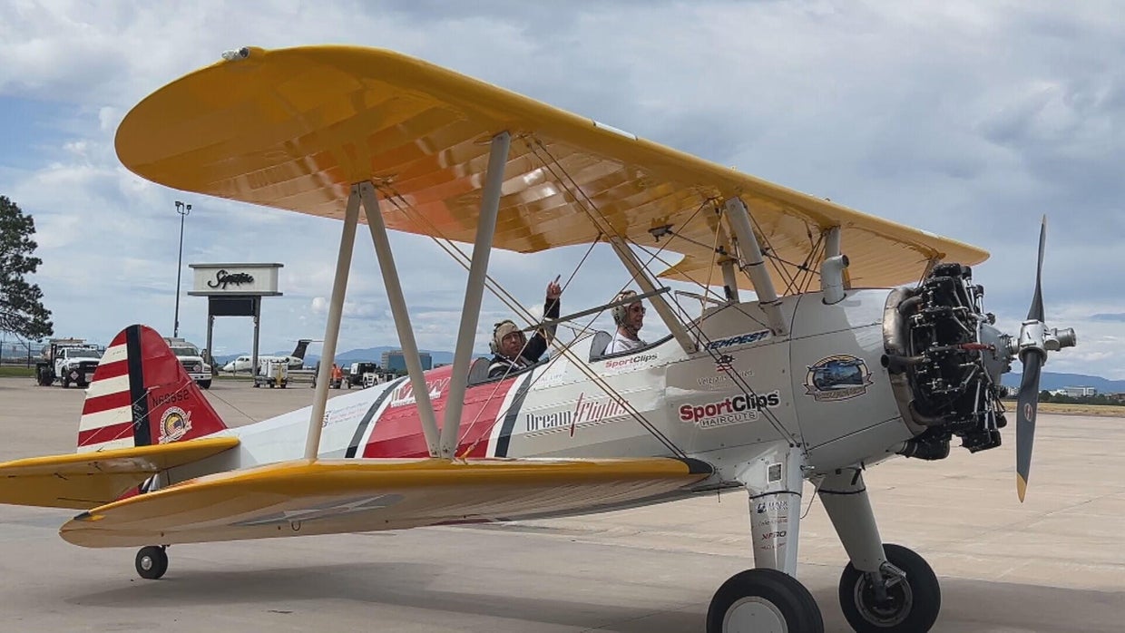 Colorado veterans take dream flight in vintage WWII biplane - CBS Colorado
