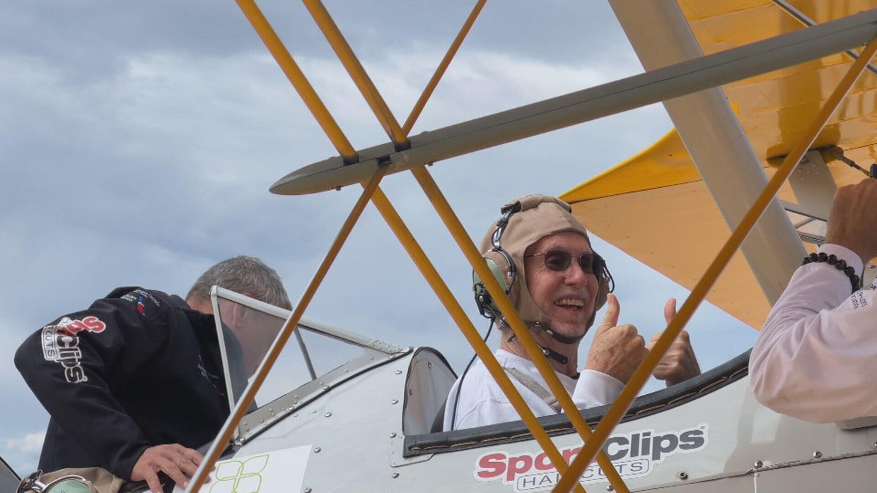 Colorado veterans take dream flight in vintage WWII biplane - CBS Colorado