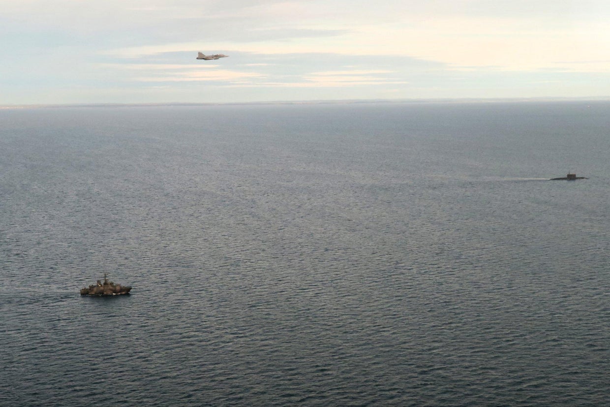 Russian submarine being followed by fighter jets and warships in Baltic ...