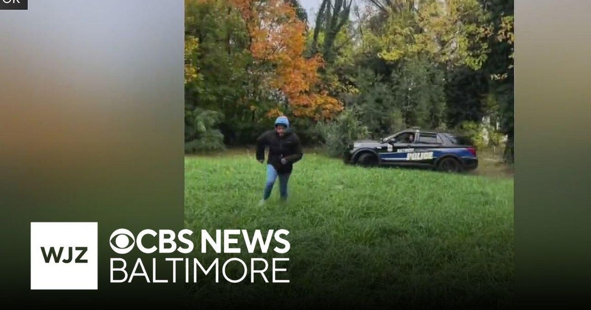 Video shows Baltimore police officer chasing person with patrol car ...