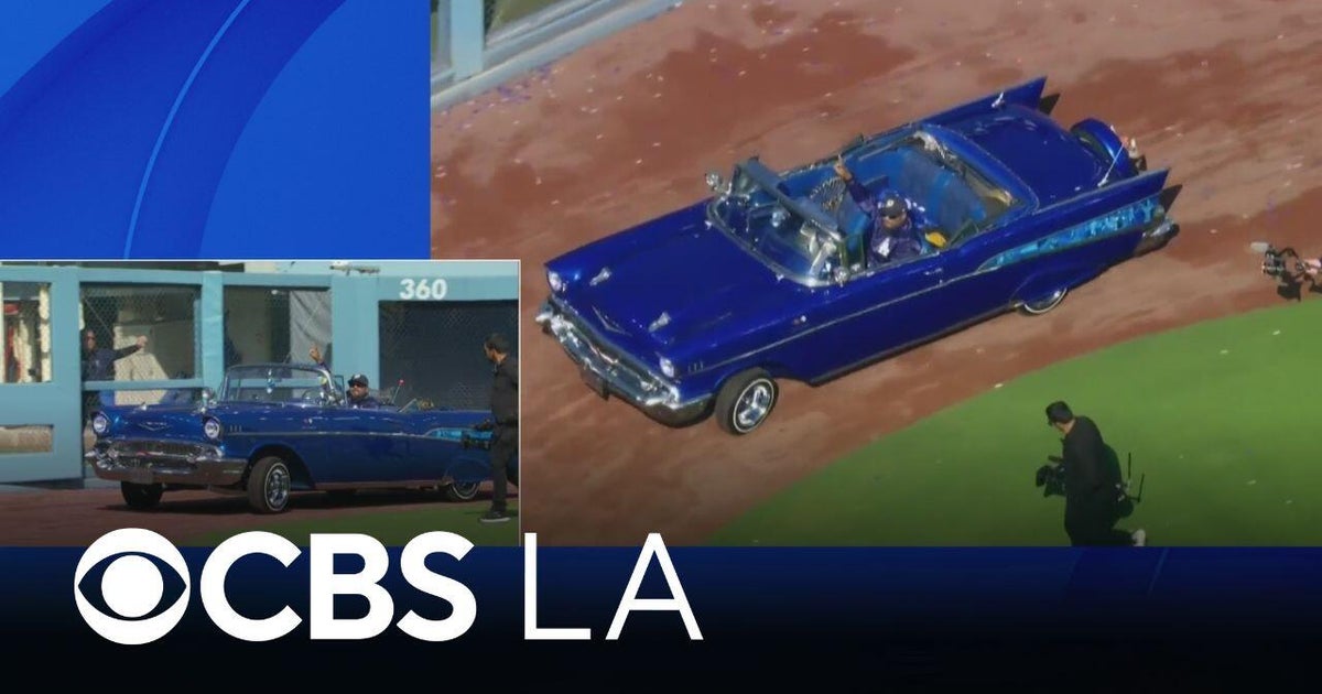 Ice Cube rolls into Dodger Stadium in style with World Series trophy ...