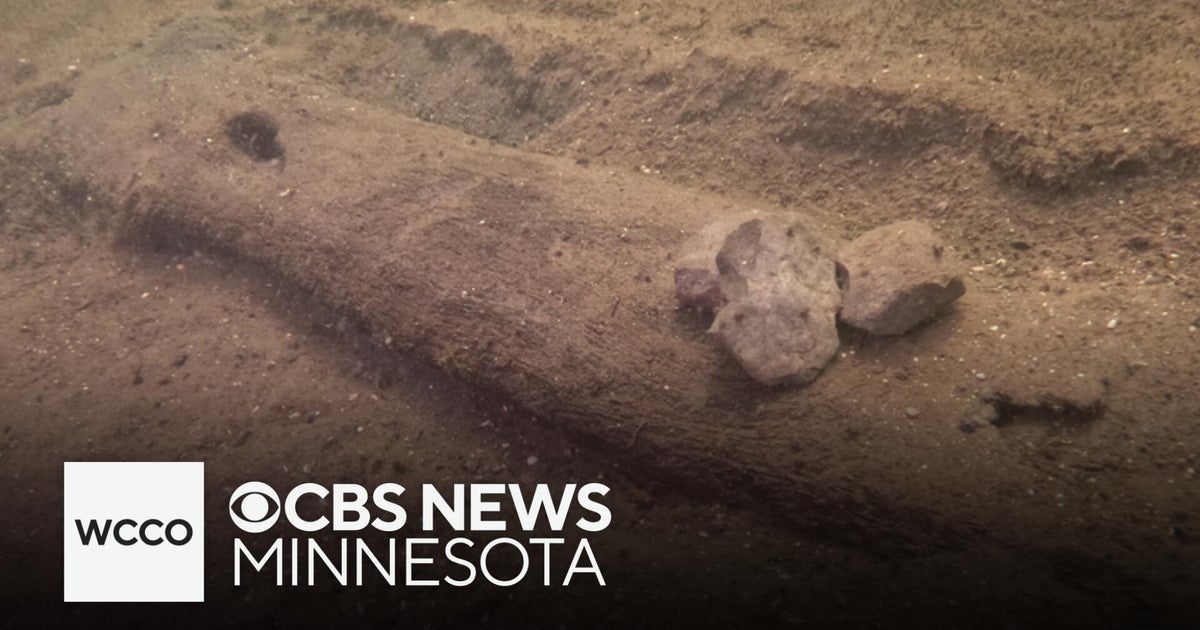Archaeologists say ancient canoes found in Wisconsin lake were like modern-day e-bike rack - CBS ...