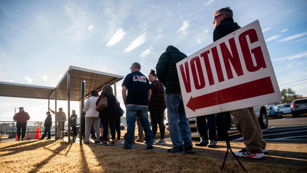 U.S. Justice Department sues Georgia for state's voter registration ...