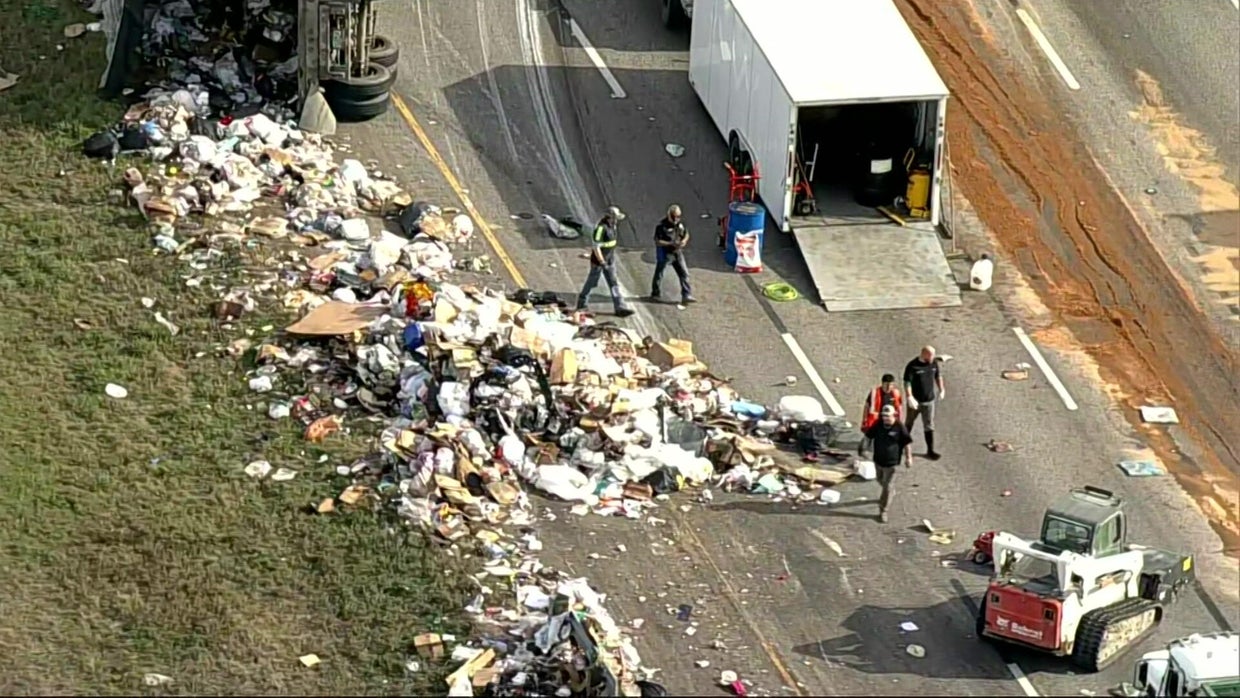 Semi hauling trash overturns on I-20 in Dallas, leading to miles of ...
