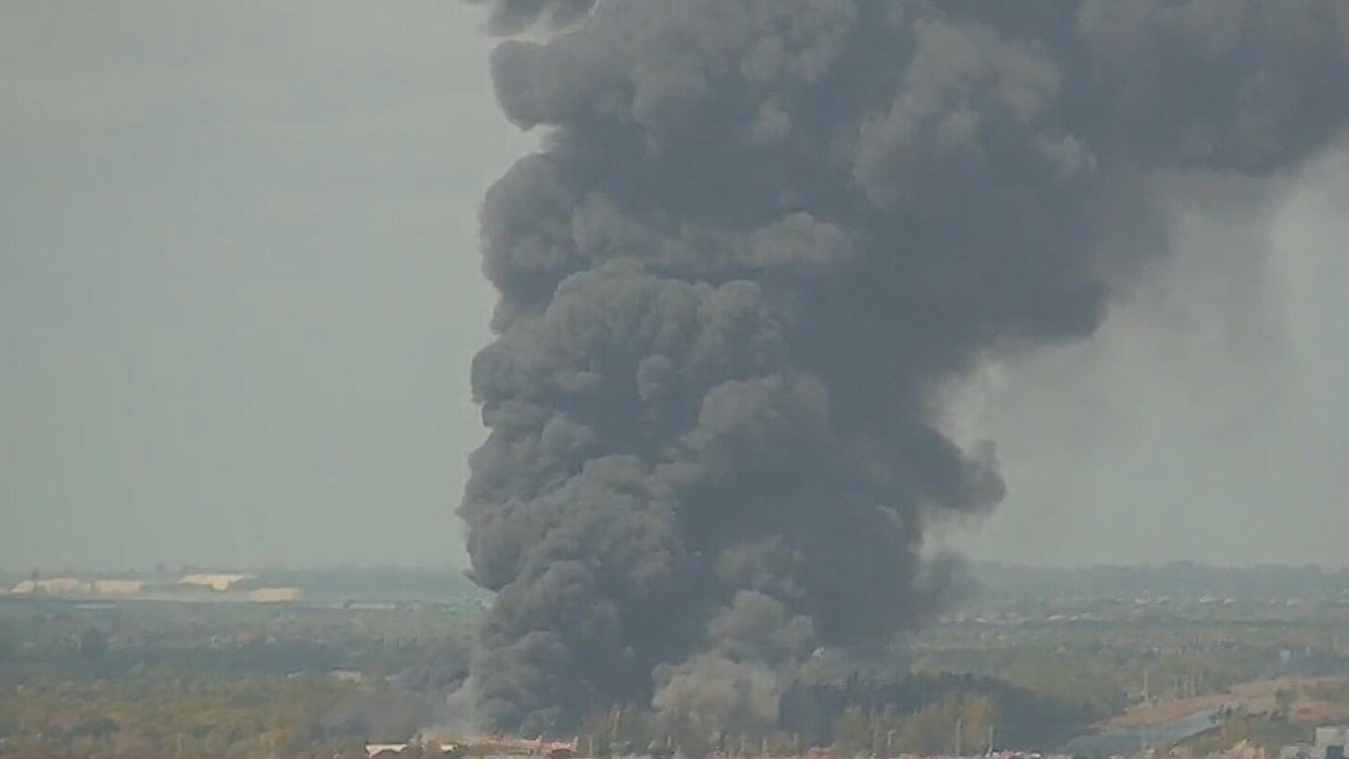 Miami-Dade warehouse fire continues to smolder 24 hours after blaze ...
