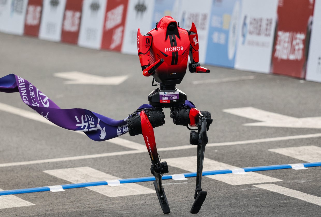 Humanoid robot beats human half-marathon world record in Beijing - CBS News