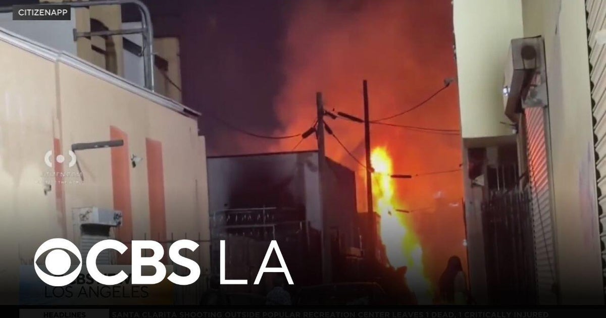 Crews continue an investigation into downtown LA commercial fire - CBS ...