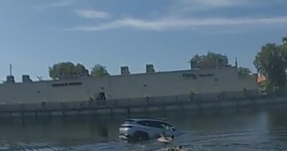 New bodycam video shows daring rescue of woman from sinking car in ...