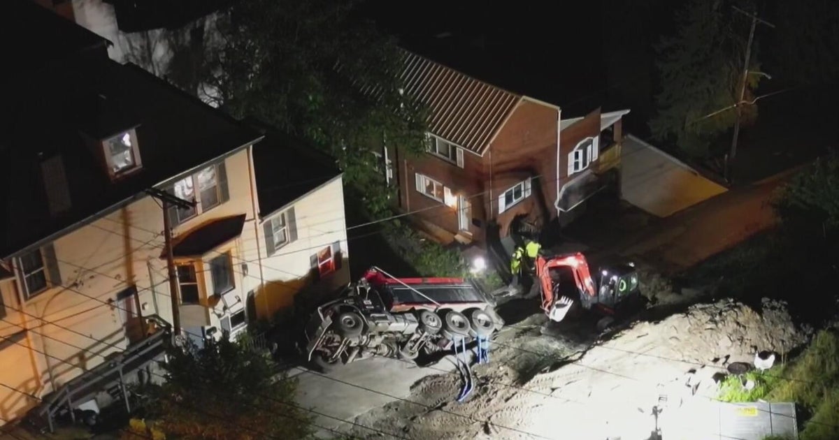 Dump truck backing down road falls into hole in Pittsburgh’s Mount ...